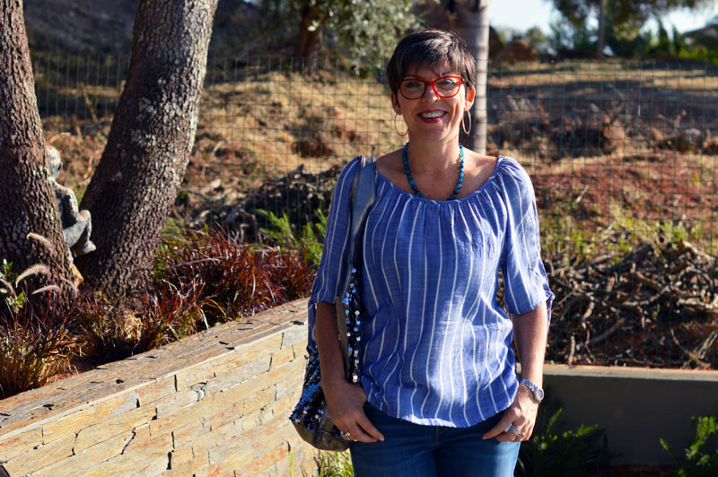 A new blue floaty blouse and silver & blue sandals Suzy Turner